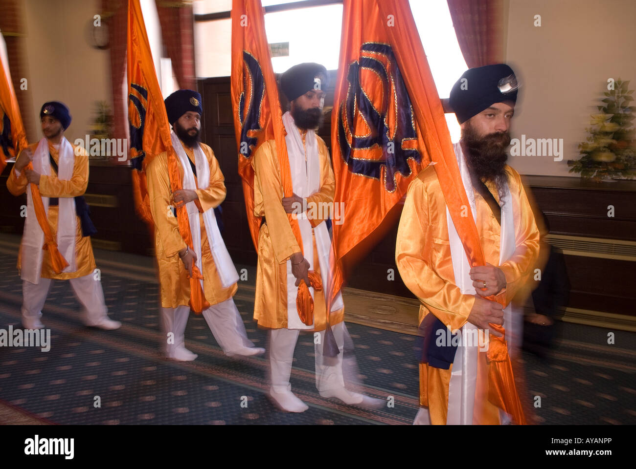 Sikh men with Sikh flags in gurdwara or temple at the festival of ...