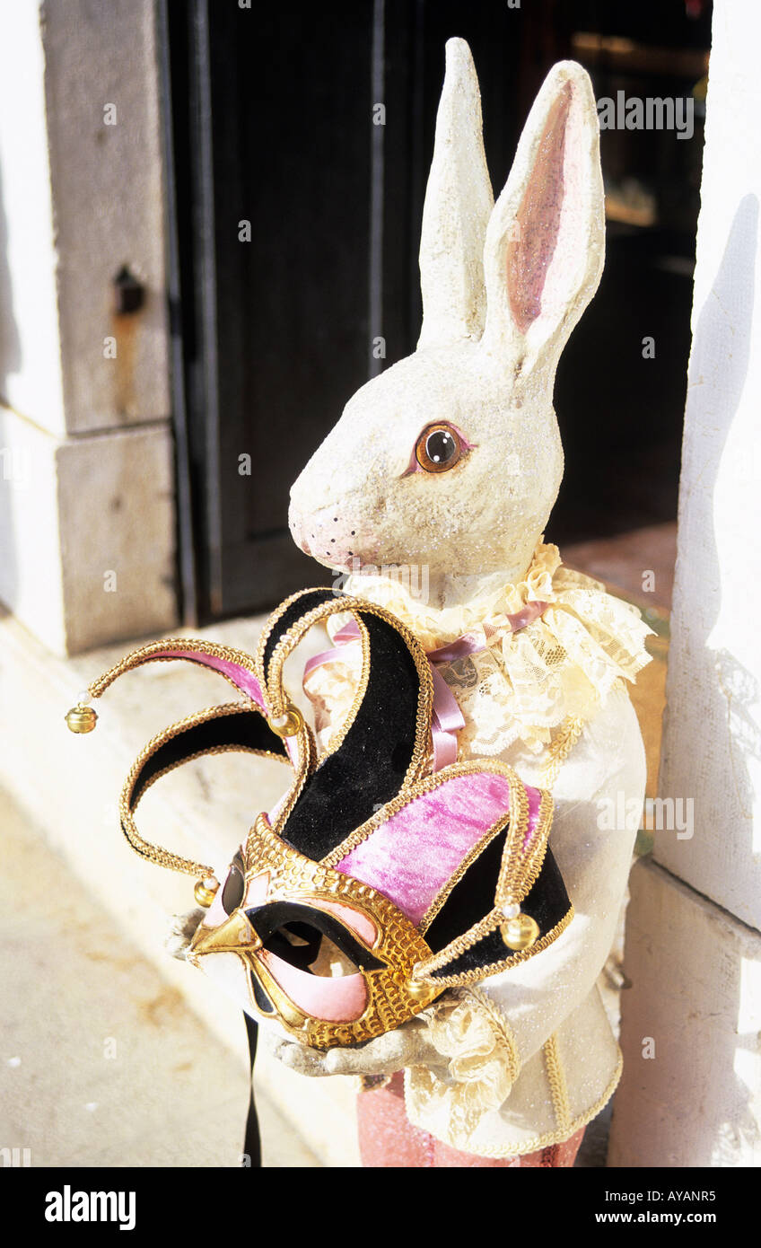Rabbit toy and mask on exterior window ledge Stock Photo - Alamy