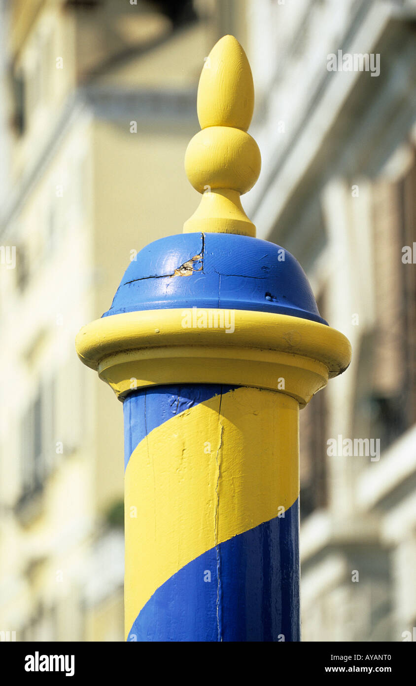 Gondola post exterior detail yellow and blue buildings in background ...