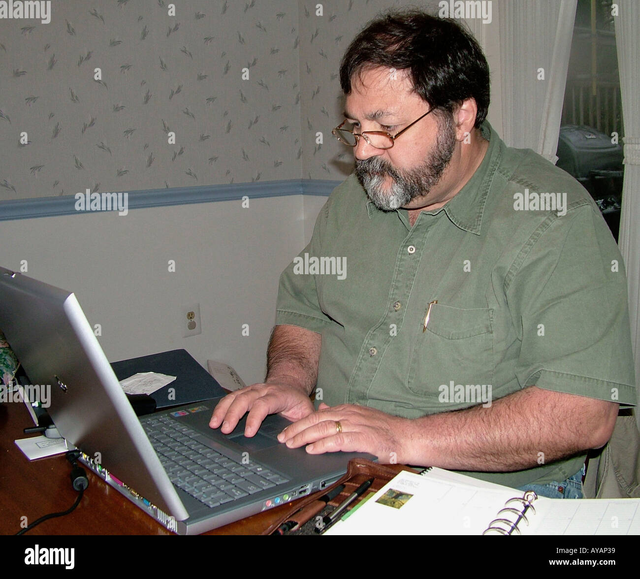 man working on laptop computer Stock Photo - Alamy