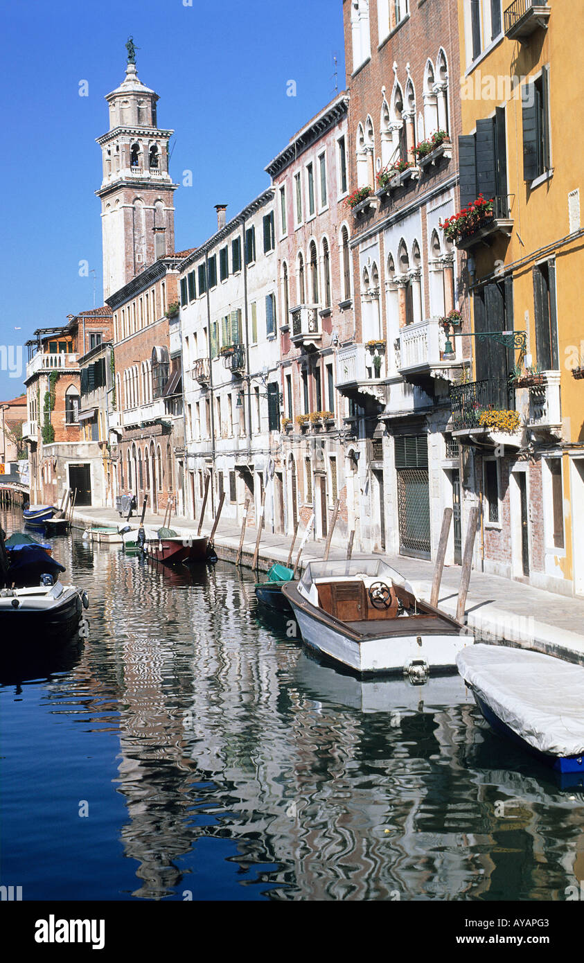 Canal side view San Barnaba boats and buildings yellow and blue Stock ...
