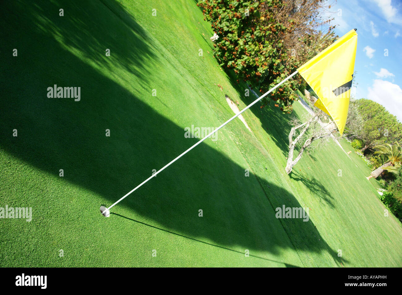 Golf flag fluttering in wind Stock Photo - Alamy