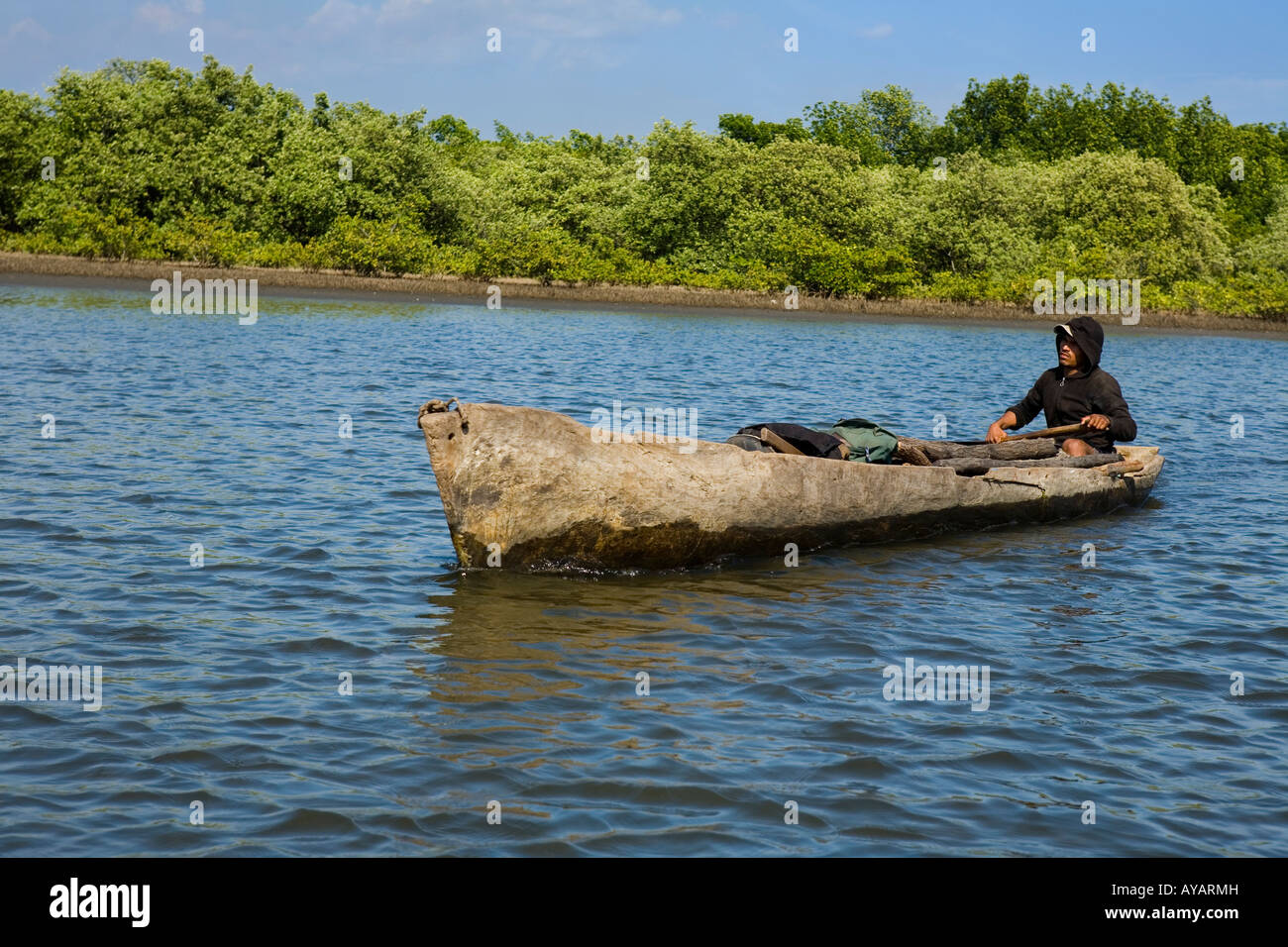 Fisherman in primitive boat Las Penitas Pacific Coast Nicaragua Stock ...
