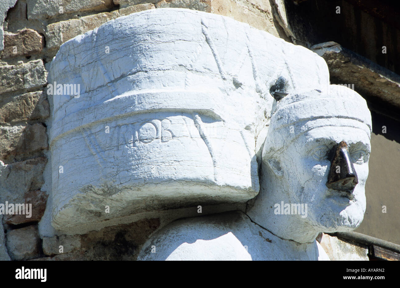 Campo dei Mori Moor statue with bronze nose building exterior white ...