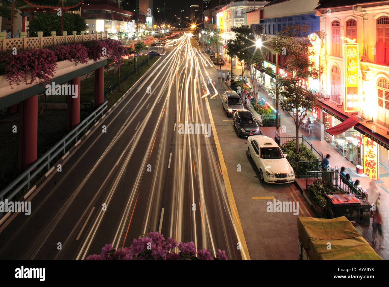 Asia Singapore Traffic light blur through city s Chinatown District ...