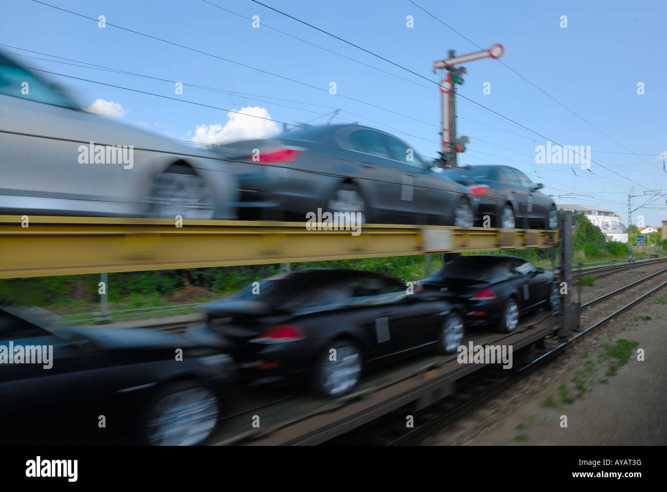 New cars are beeing transported by train Stock Photo - Alamy