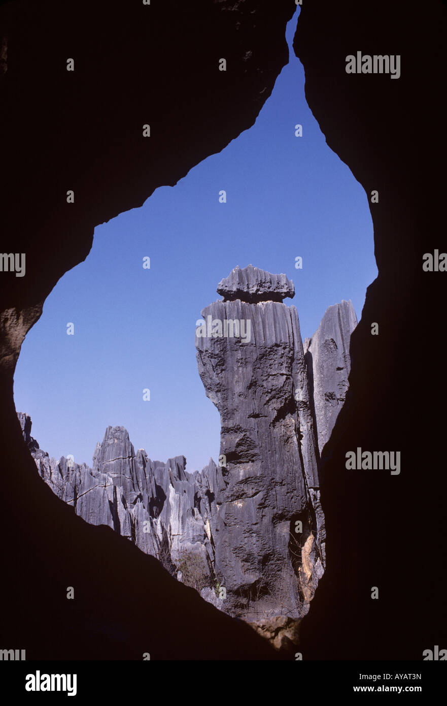 Natural hole in rock Stone Forest National Geopark Yunnan Province ...