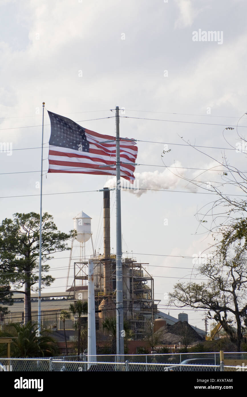 The American flag flying over a manufacturing plant Stock Photo - Alamy