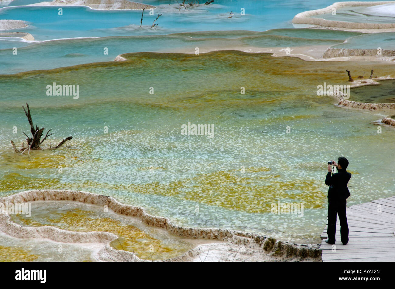 Photographing travertine terraces part of karst landscape at Huanglong ...