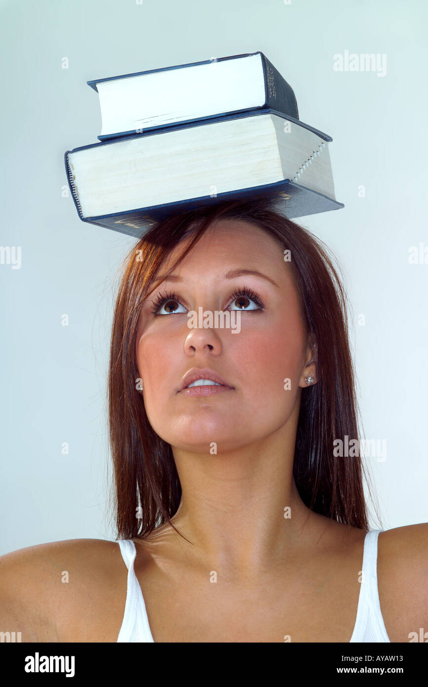 Model woman balancing books head hi-res stock photography and images ...