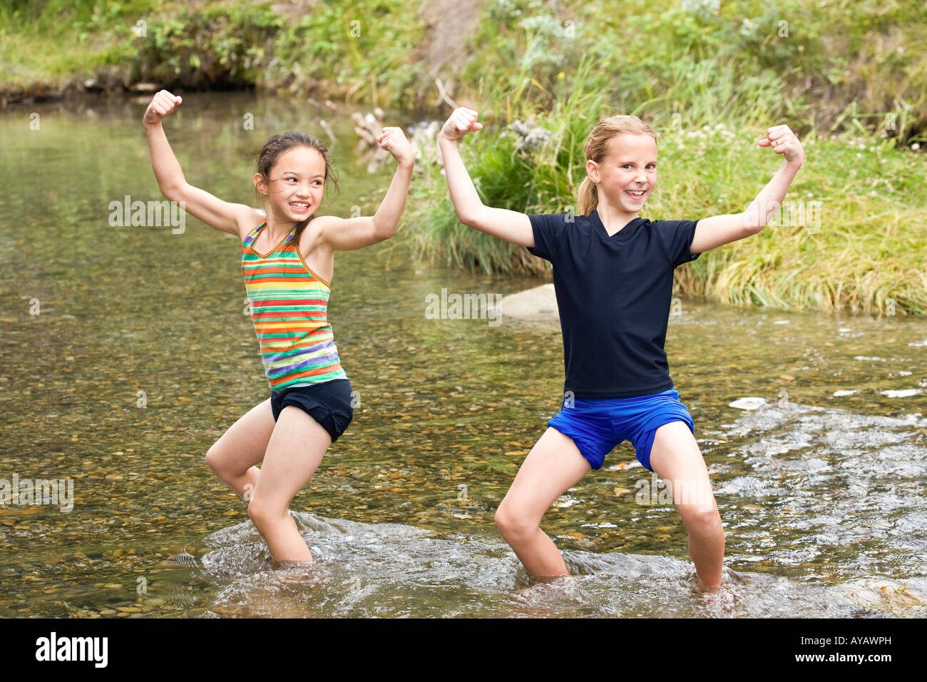 Children playing in stream Stock Photo - Alamy