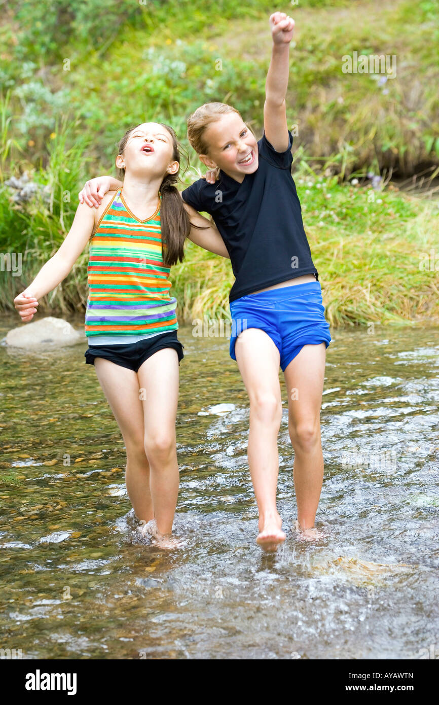 Children playing in stream Stock Photo - Alamy