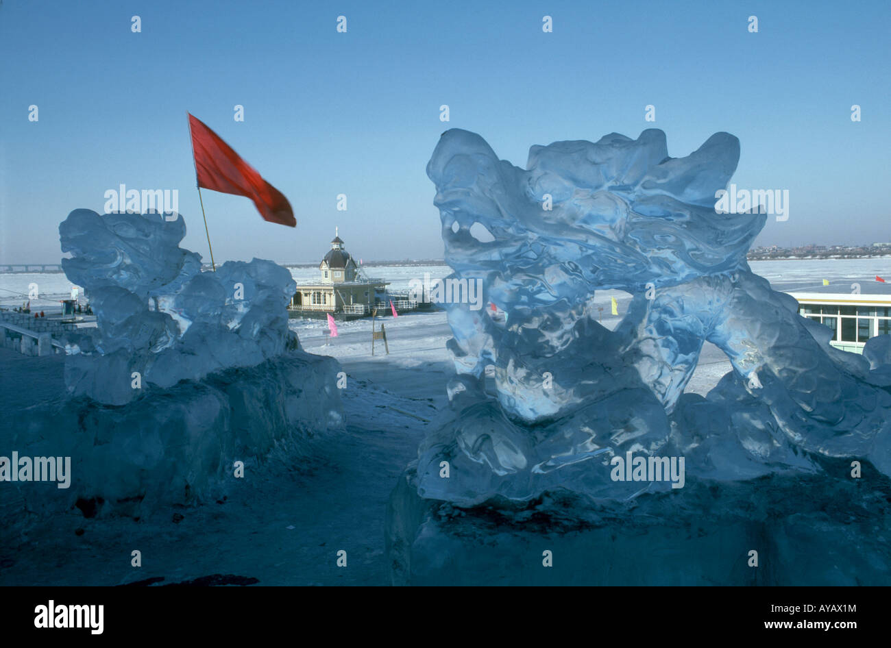 Dragon ice sculptures by Songhua River with red flag, Harbin, China ...