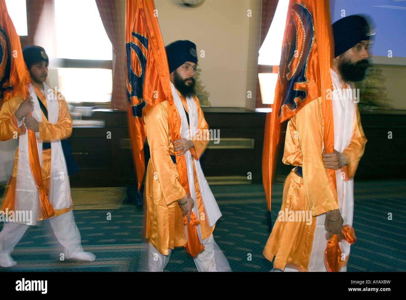 Sikh men with Sikh flags in gurdwara or temple at the festival of ...