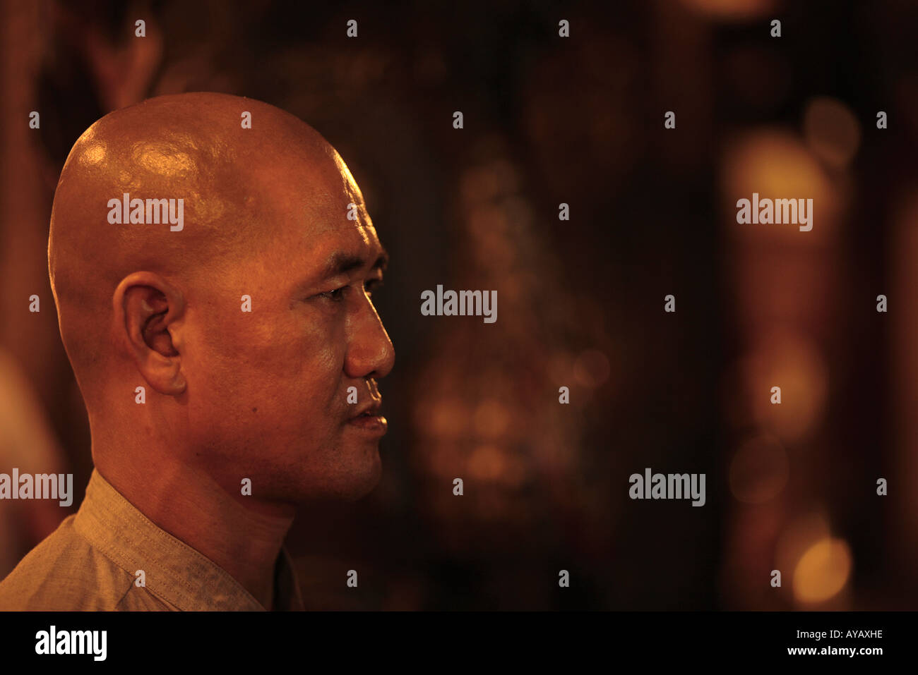 Taiwan Taipei Buddhist monk with shaved head at prayer inside Long Sham ...