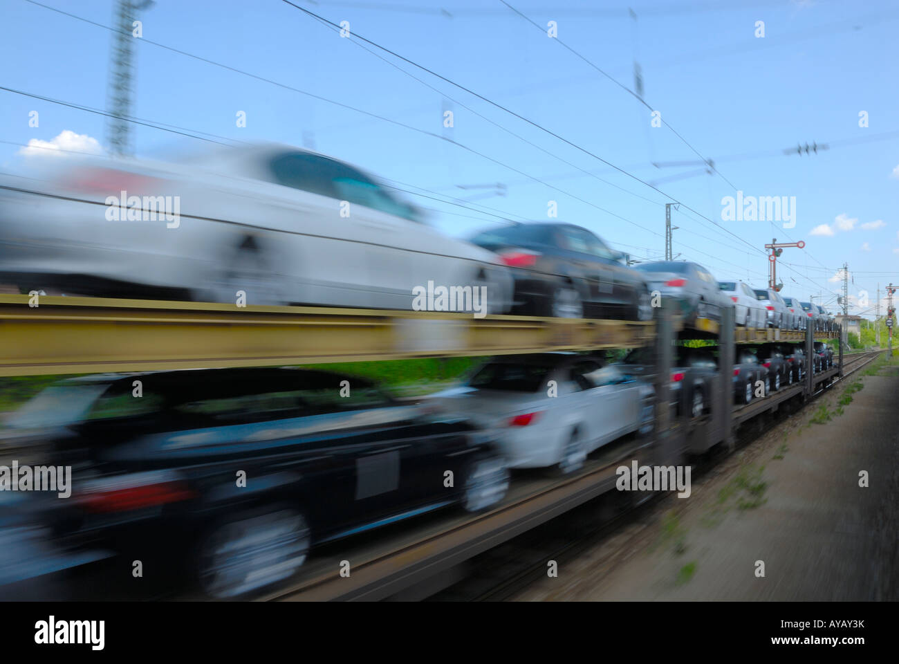 New cars are beeing transported by train Stock Photo - Alamy