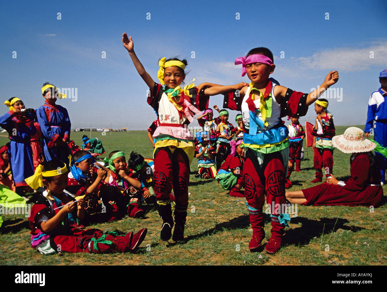 Costumed Mongolian children dancing at Nadam Summer Festival on ...