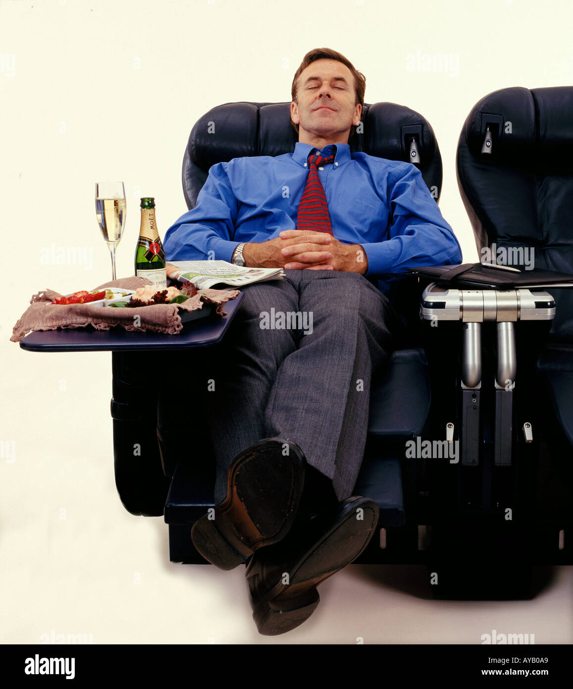 Man first class plane hi-res stock photography and images - Alamy