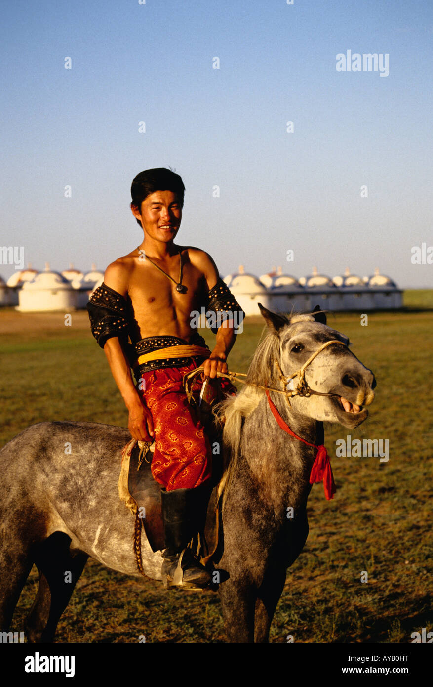 Young Mongolian horseman at Nadam Summer Festival on grasslands of ...