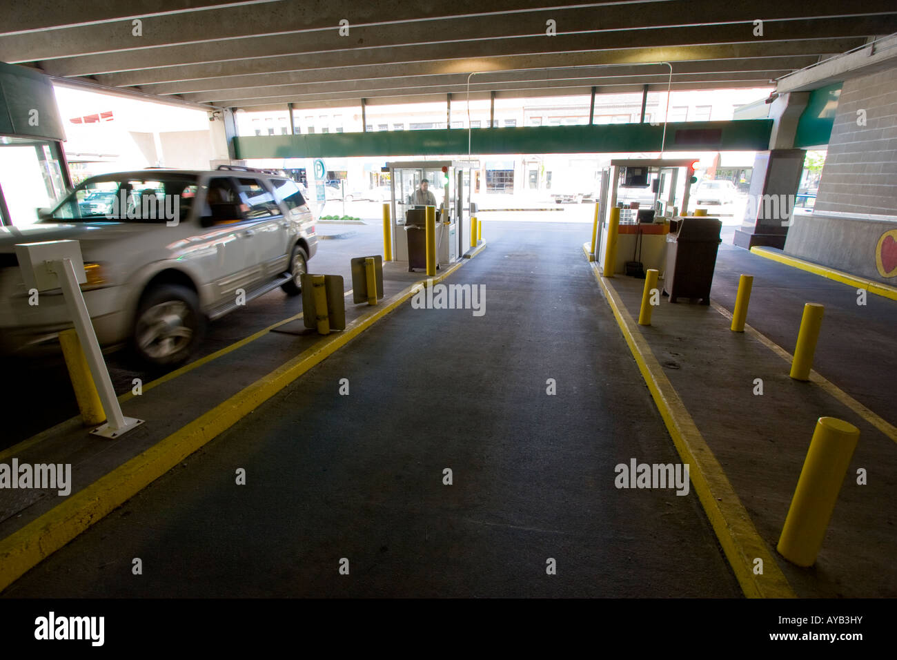 A car pulls through a parking garage entrance in Lincoln, Nebraska ...