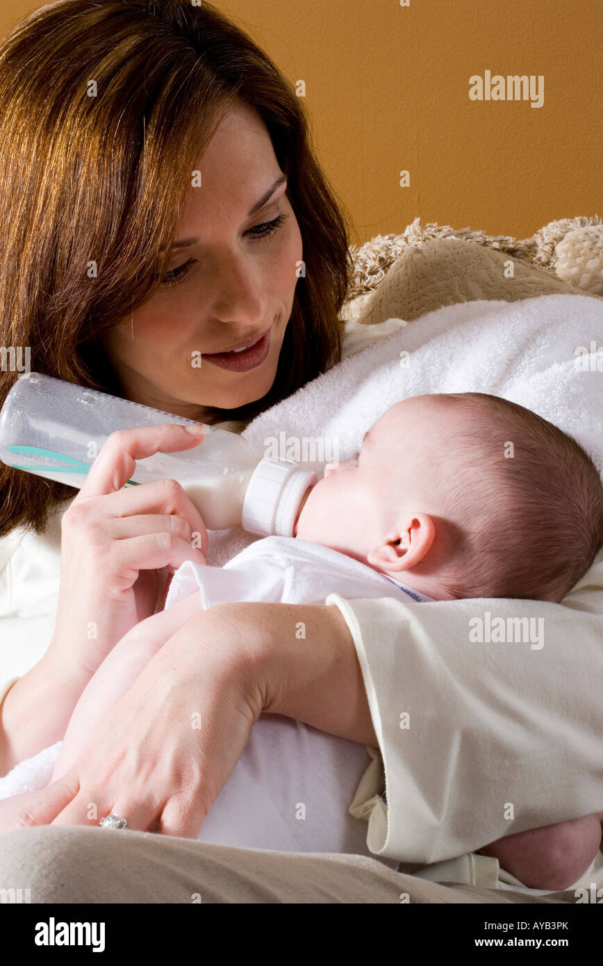 Close-up of a mother bottle-feeding baby Stock Photo - Alamy