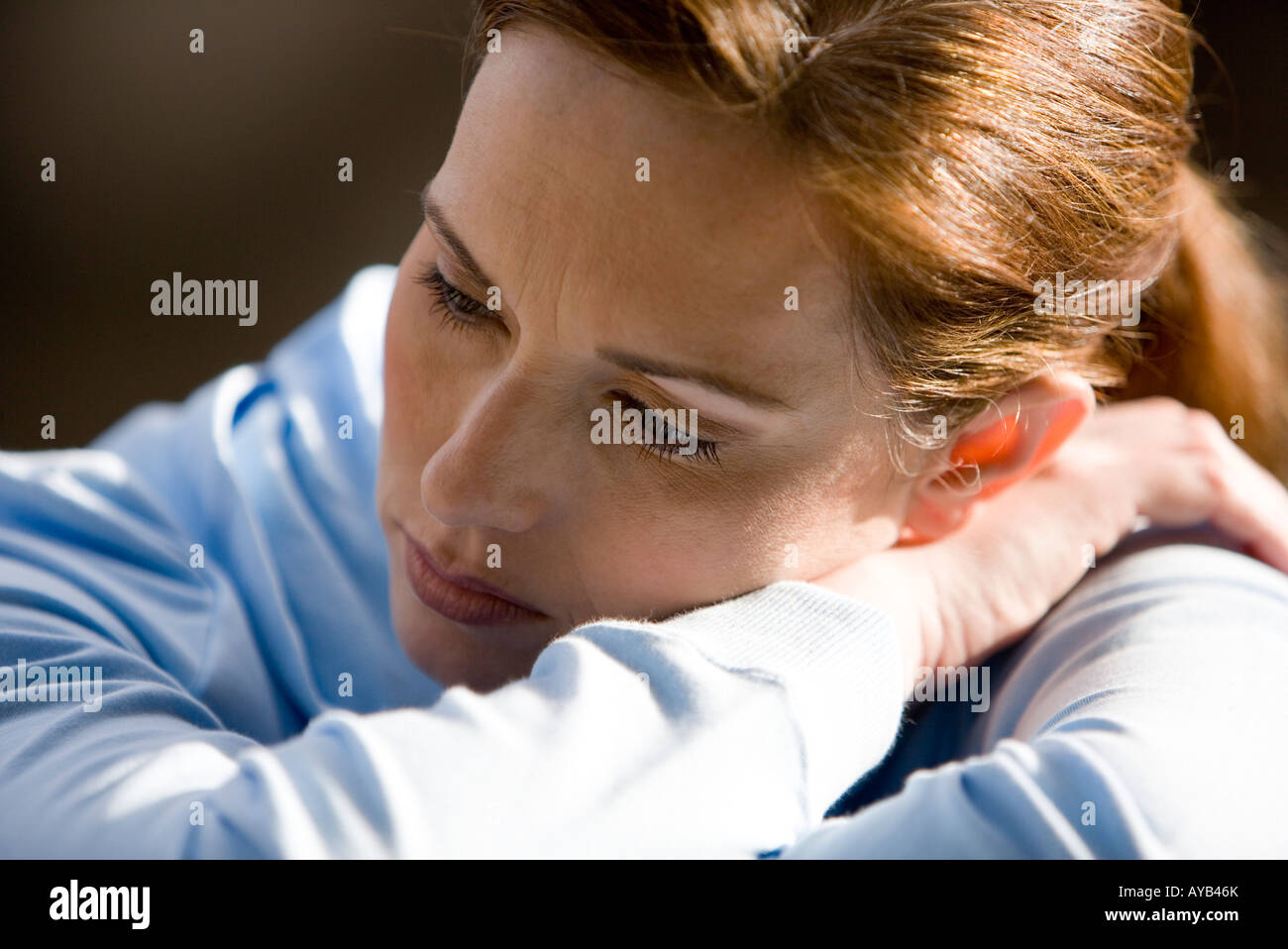 Close-up of a young woman thinking Stock Photo - Alamy