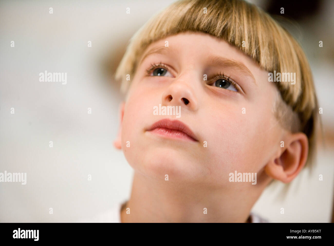 Close-up of a boy staring up into space Stock Photo - Alamy