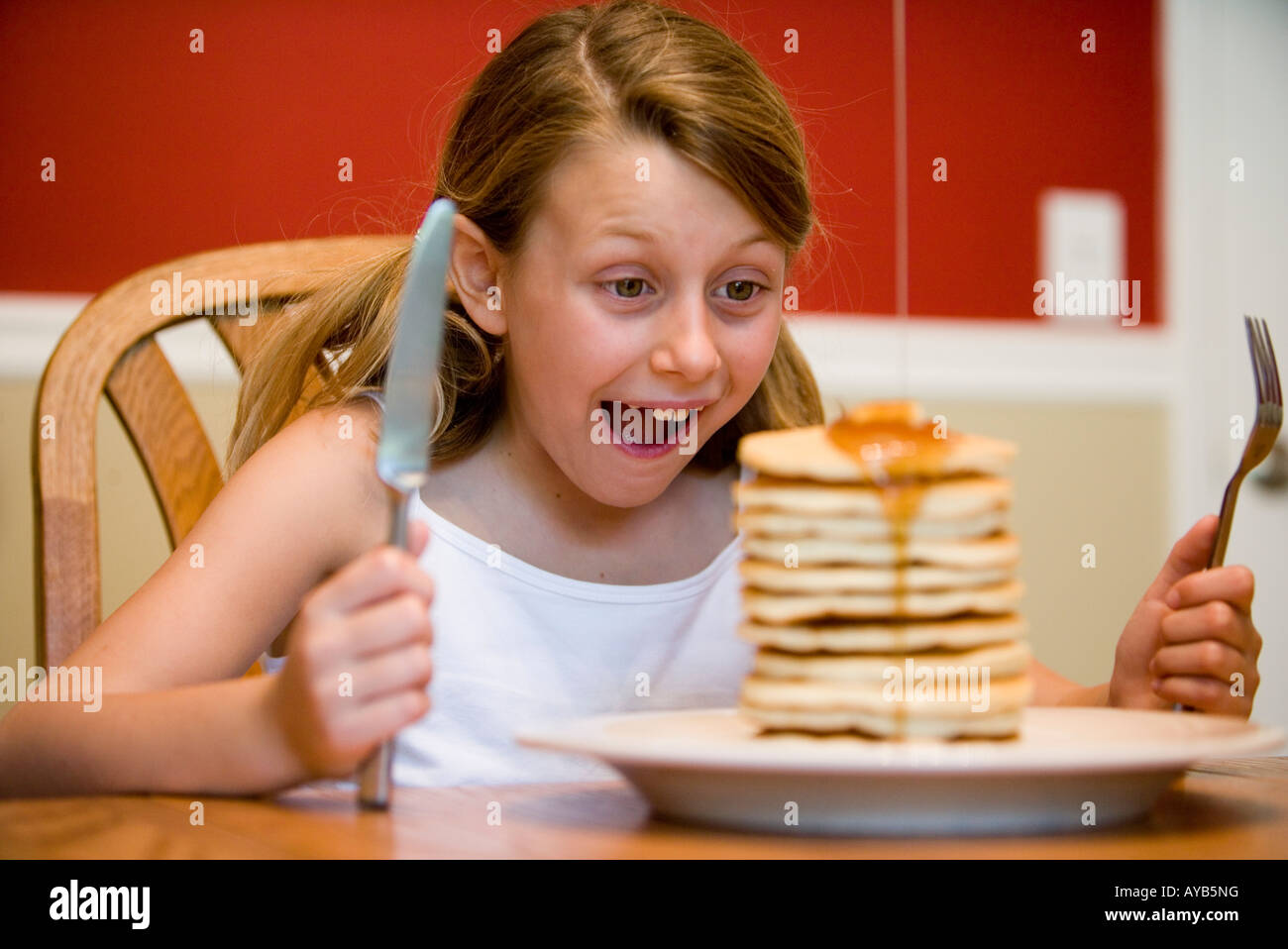 Child ready to eat huge stack of pancakes Stock Photo - Alamy