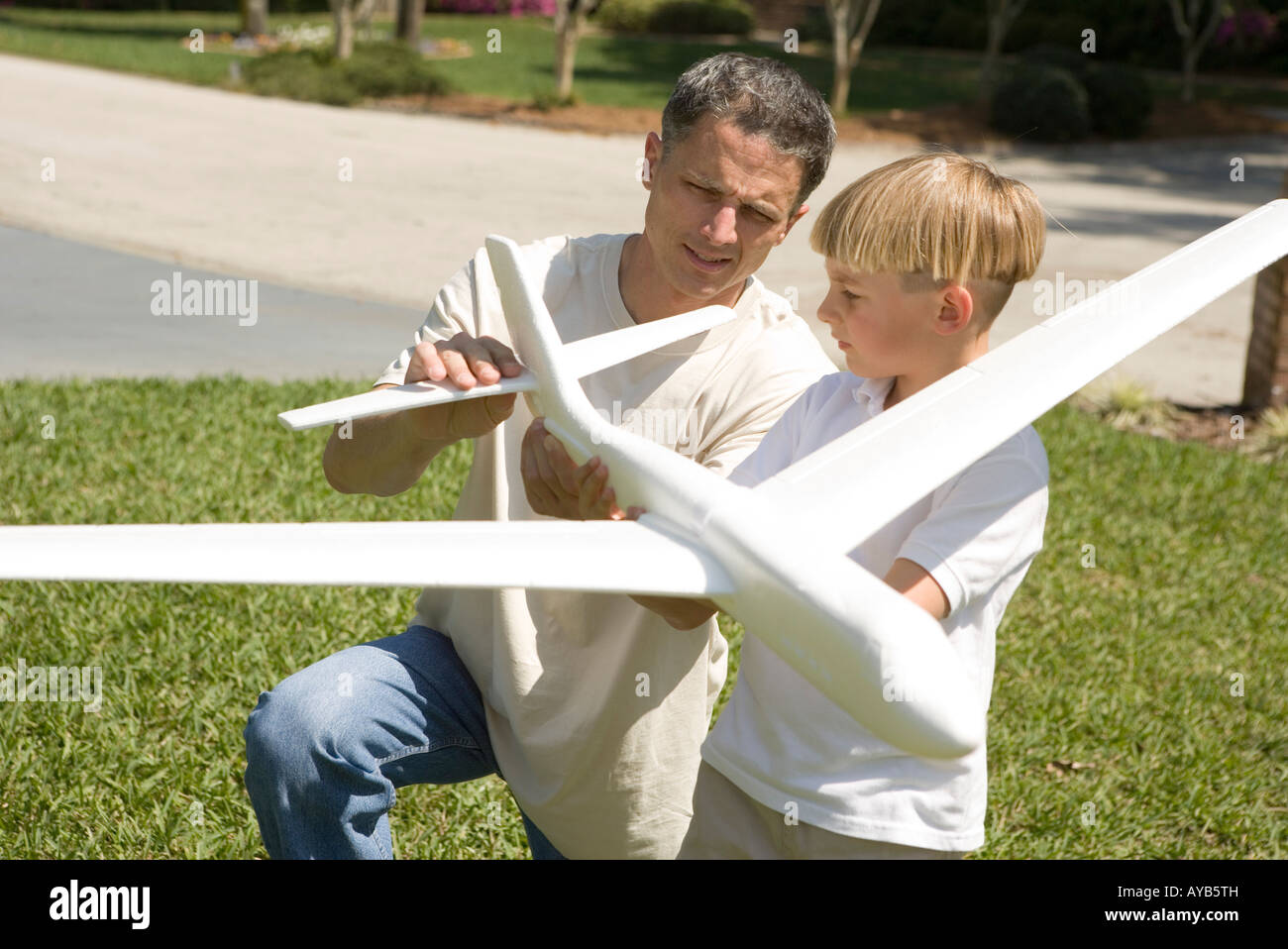 Father and son with a toy glider Stock Photo - Alamy
