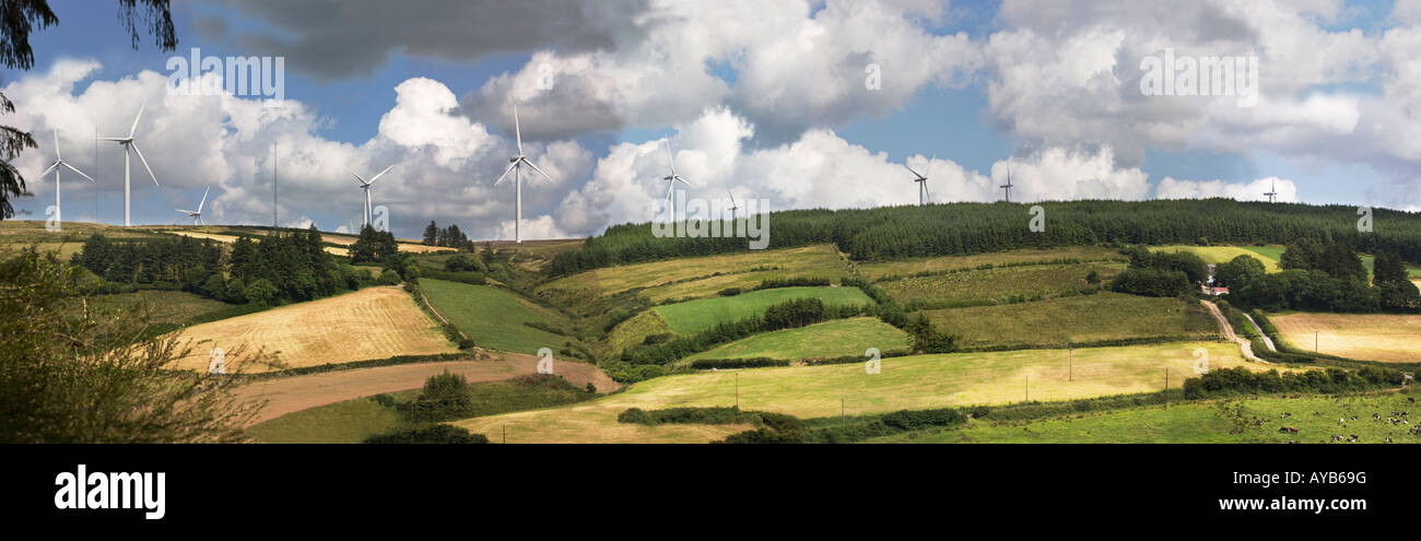 Panorama of wind power turbines on windfarm producing electricity for ...