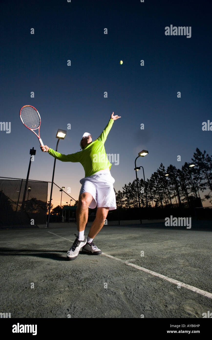 Tennis player serving Stock Photo - Alamy