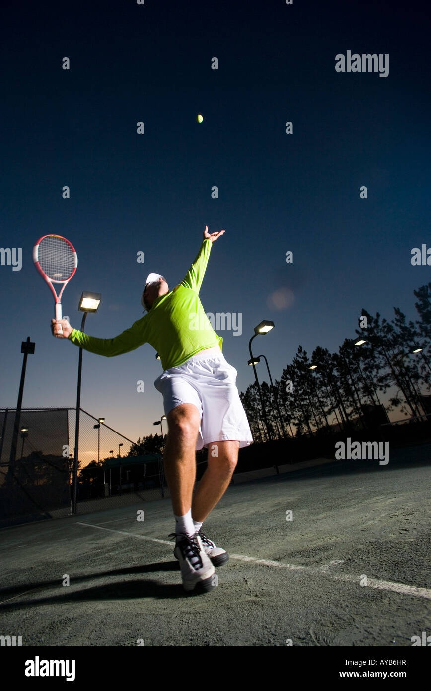 Tennis player serving Stock Photo - Alamy