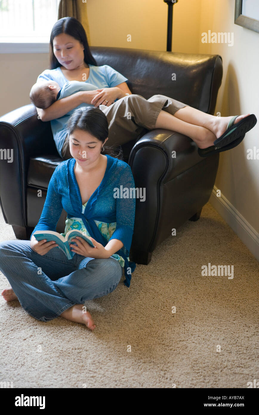 Family relaxing at home Stock Photo - Alamy