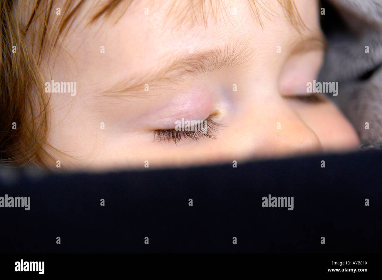 baby brunette caucasian sleep eyes closed close up face head detail ...