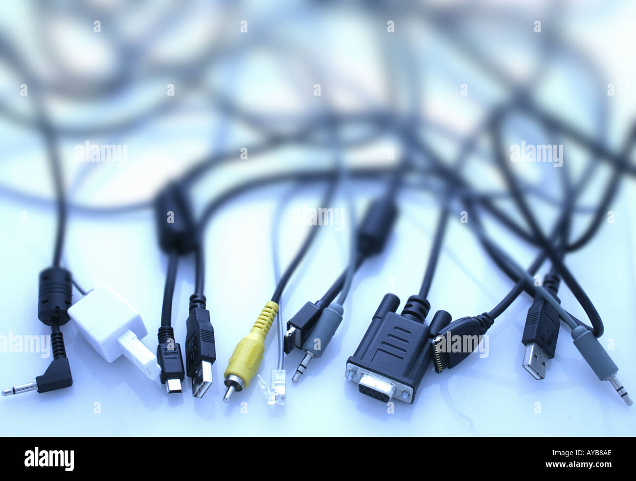 Conceptual image showing a mass of computer related cables and wires ...