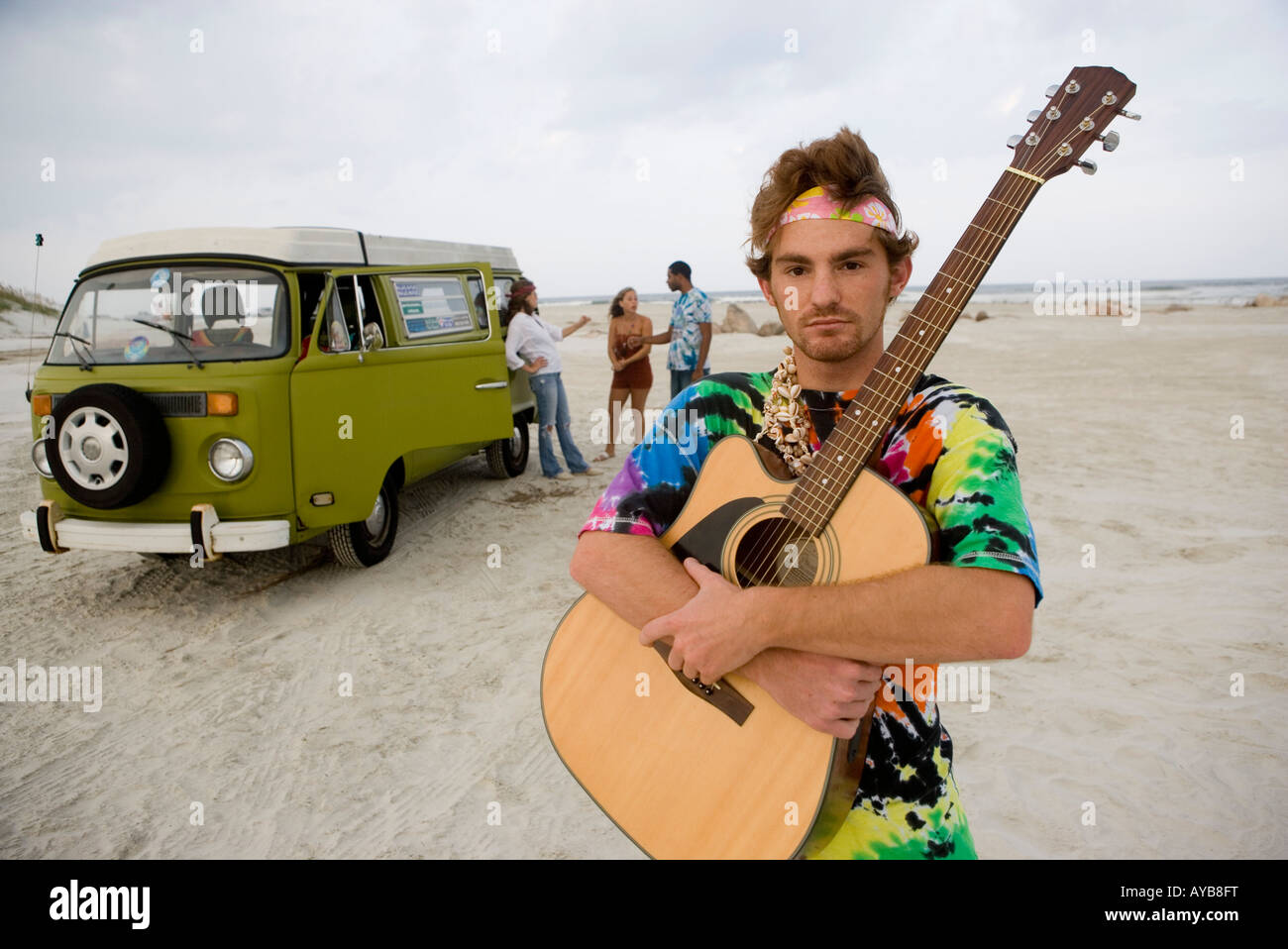 Hippies at the beach with guitar Stock Photo - Alamy