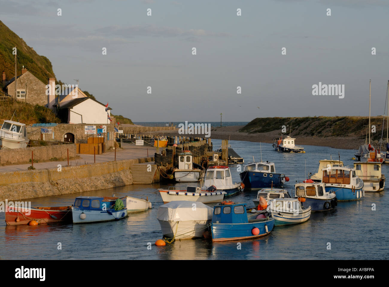 Boats moored in the mouth of the River Axe Axmouth Devon England UK ...
