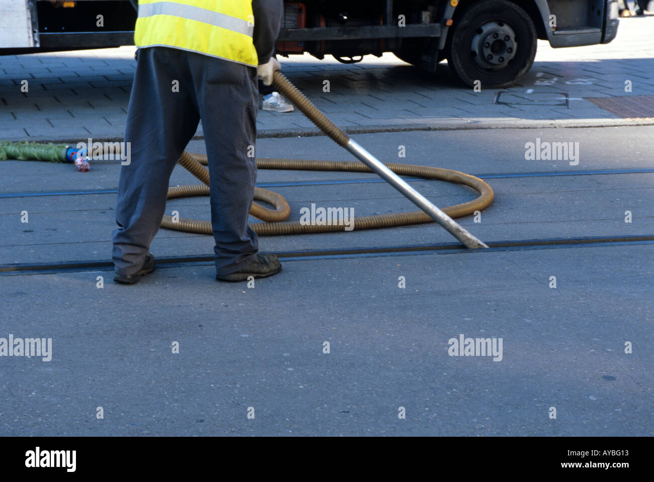 Tram line cleaning Stock Photo - Alamy