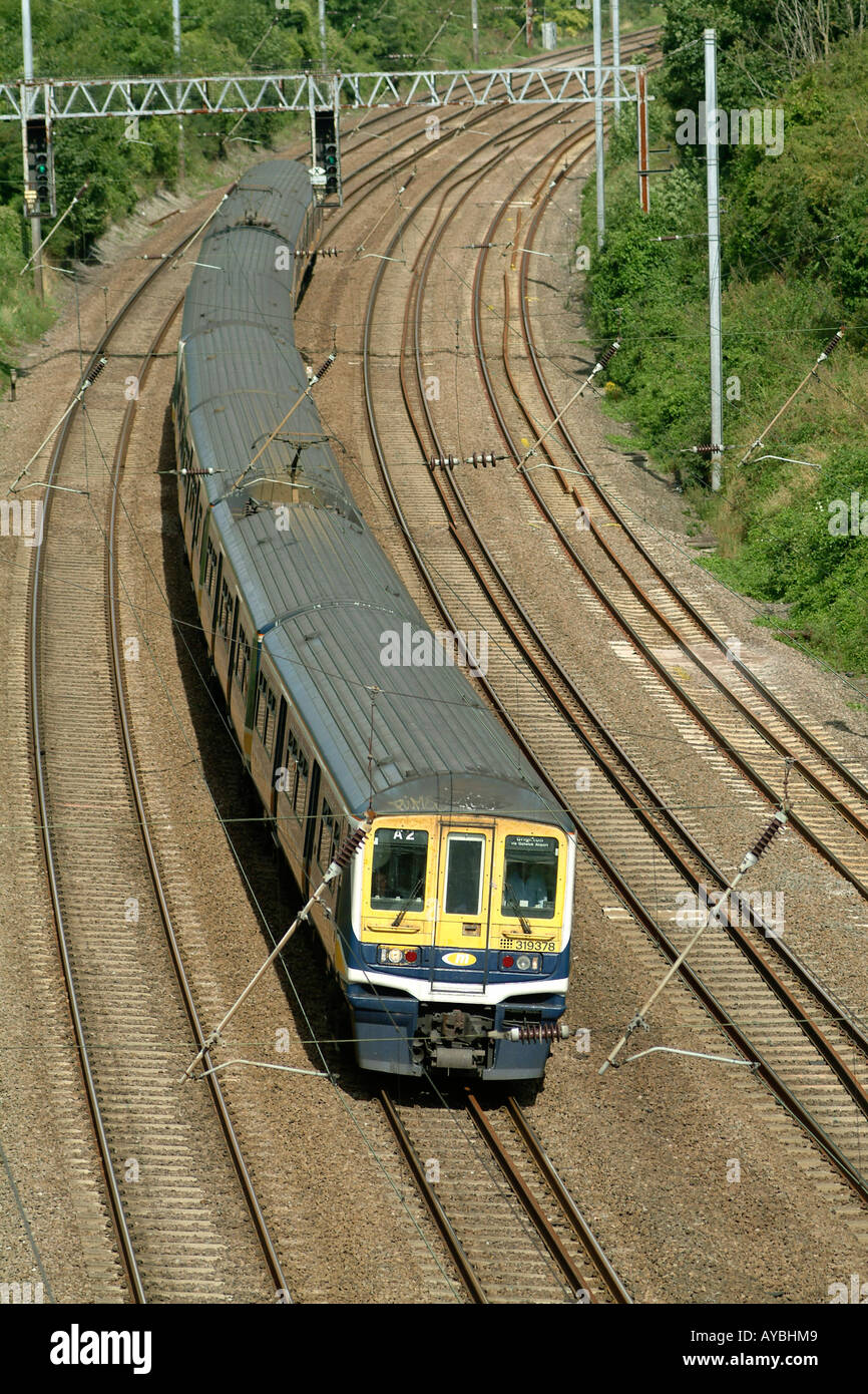 Thameslink class 319 train travelling through the british countryside ...