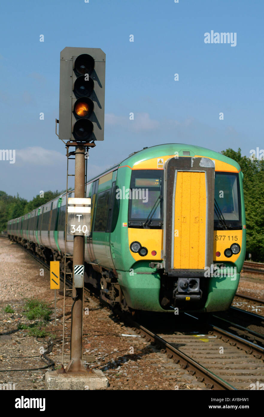 South Central Class 377 train passing a railway signal Stock Photo - Alamy