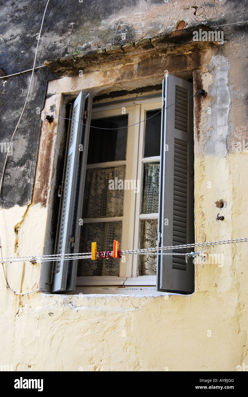 A window with half open shutters from an aged house Stock Photo - Alamy