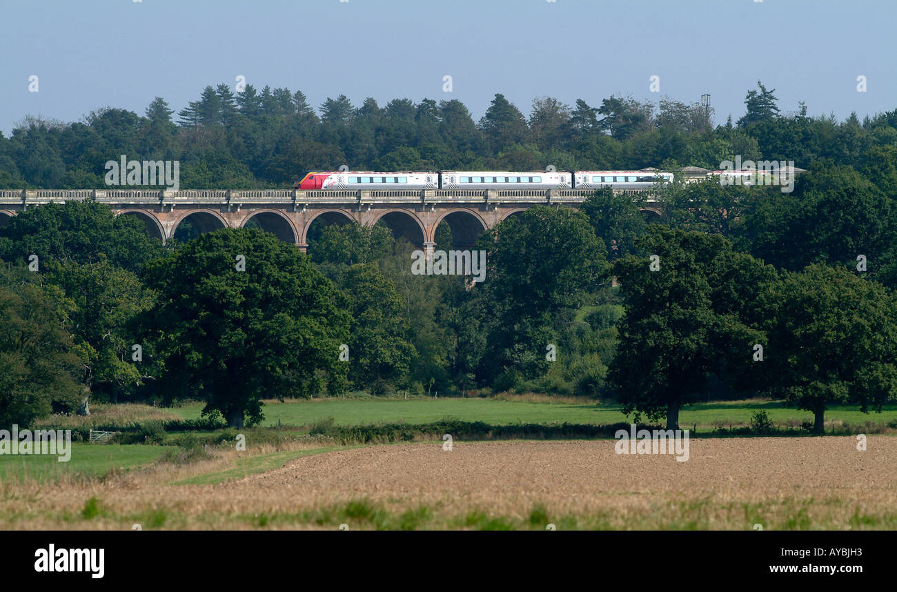 Virgin Voyager train passing over viaduct in the English countryside ...