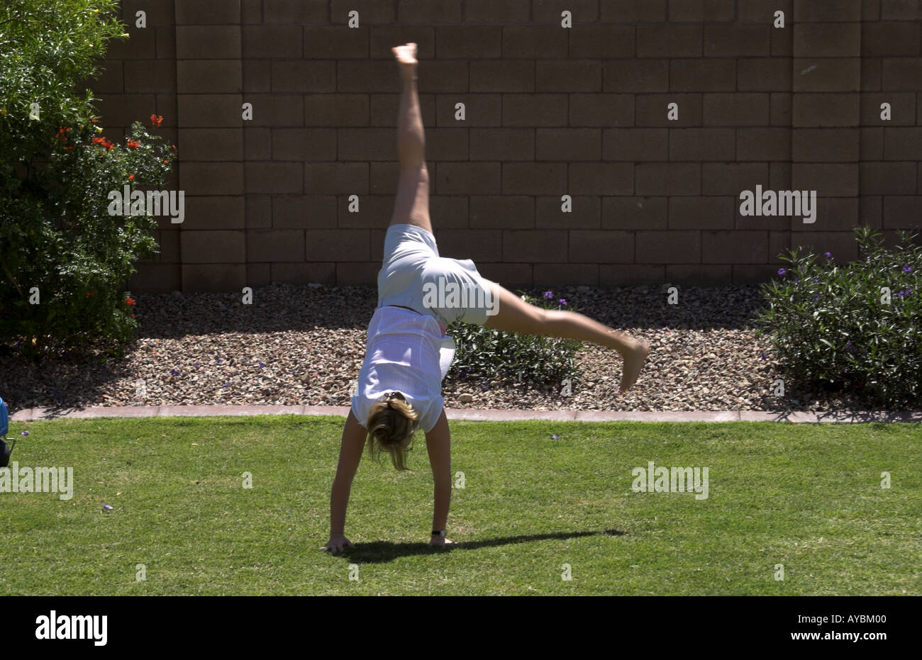 Woman cartwheel grass hi-res stock photography and images - Alamy