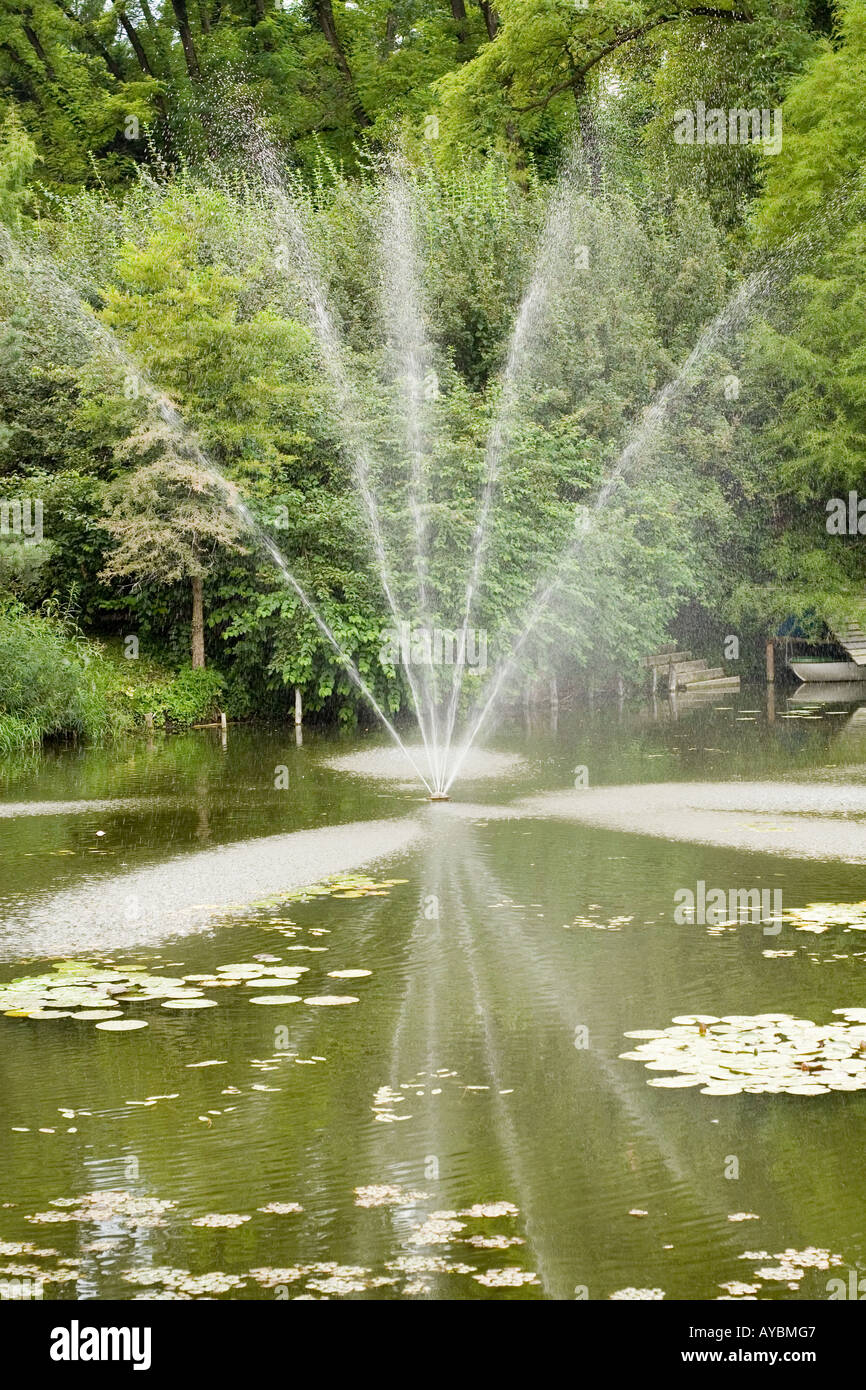 fountain in the pond Stock Photo - Alamy