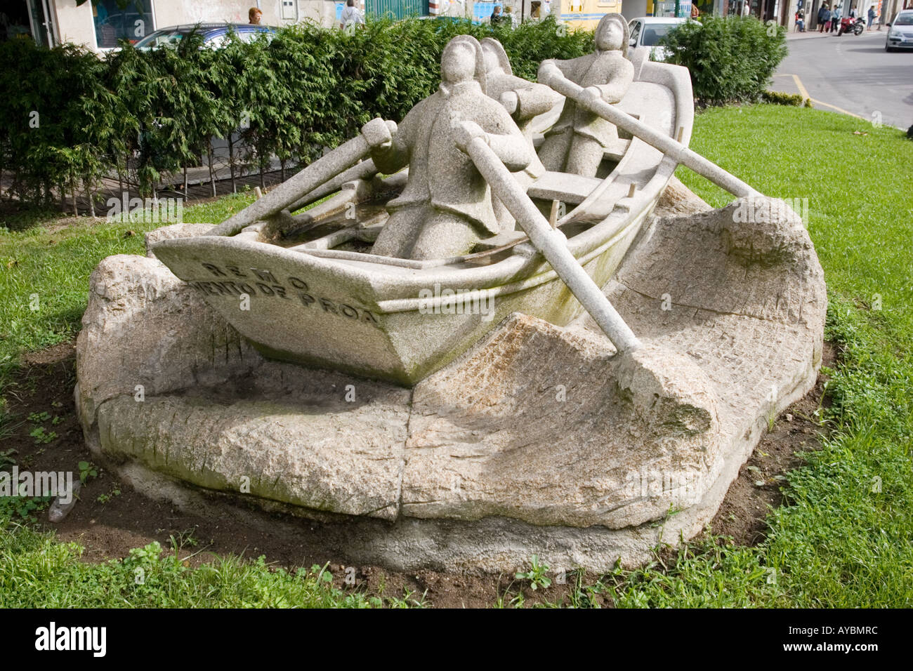 Stone sculpture of three sailors rowing a small boat Cangas Spain Stock ...