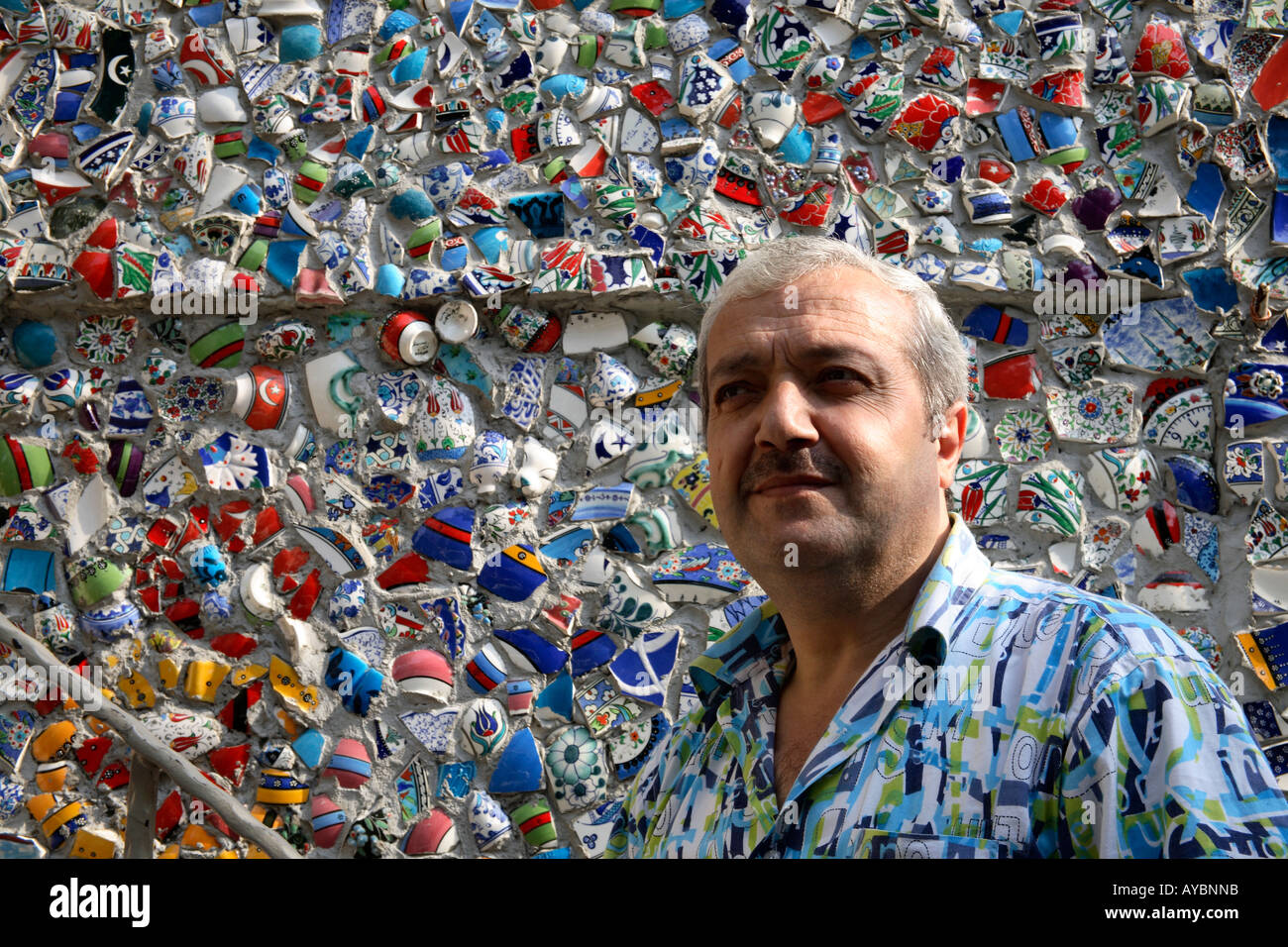 Turkish man in front of pottery shards embedded in wall. Sultanahmet ...