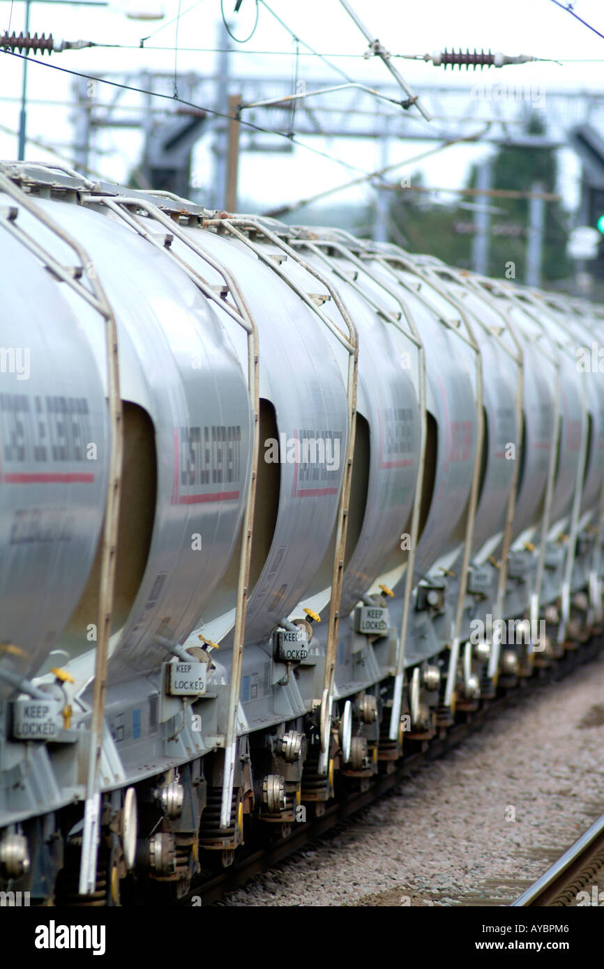 Freight train hauling Castle Cement tanks on an English railway line ...