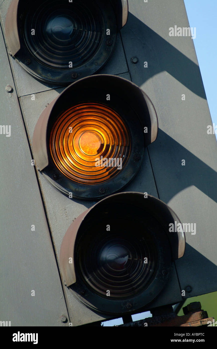 Railway signal at amber in the uk Stock Photo - Alamy