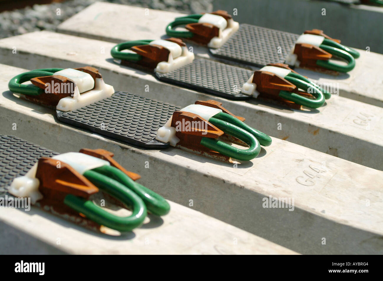 Track clips on railway sleepers in the UK Stock Photo - Alamy
