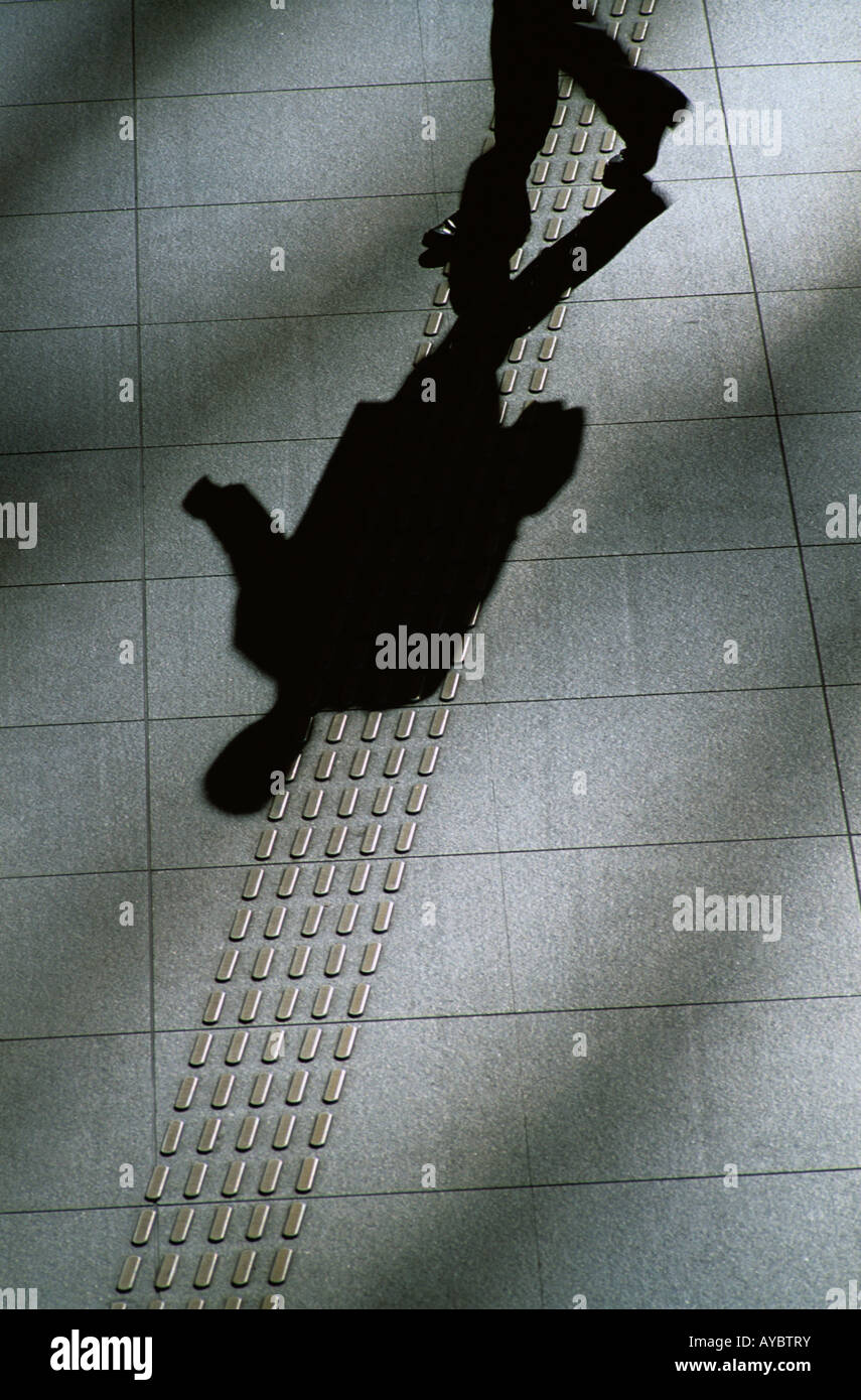 Man Walking with Shadow Stock Photo - Alamy